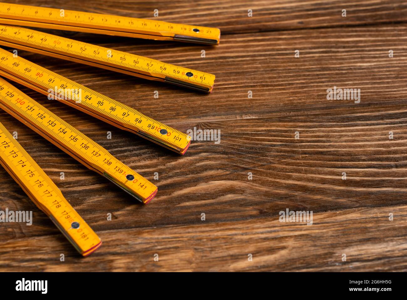 Yellow wooden folding ruler on hi-res stock photography and images - Alamy