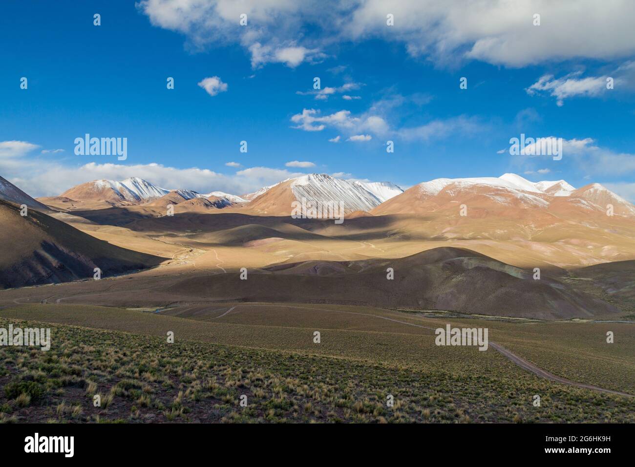 Snow covered mountains soaring from altiplano in Bolivia Stock Photo ...