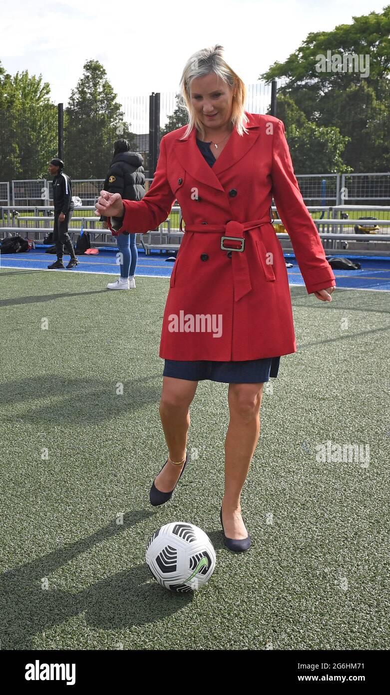Minister for Digital and Culture Caroline Dinenage playing football as she met girls from ...