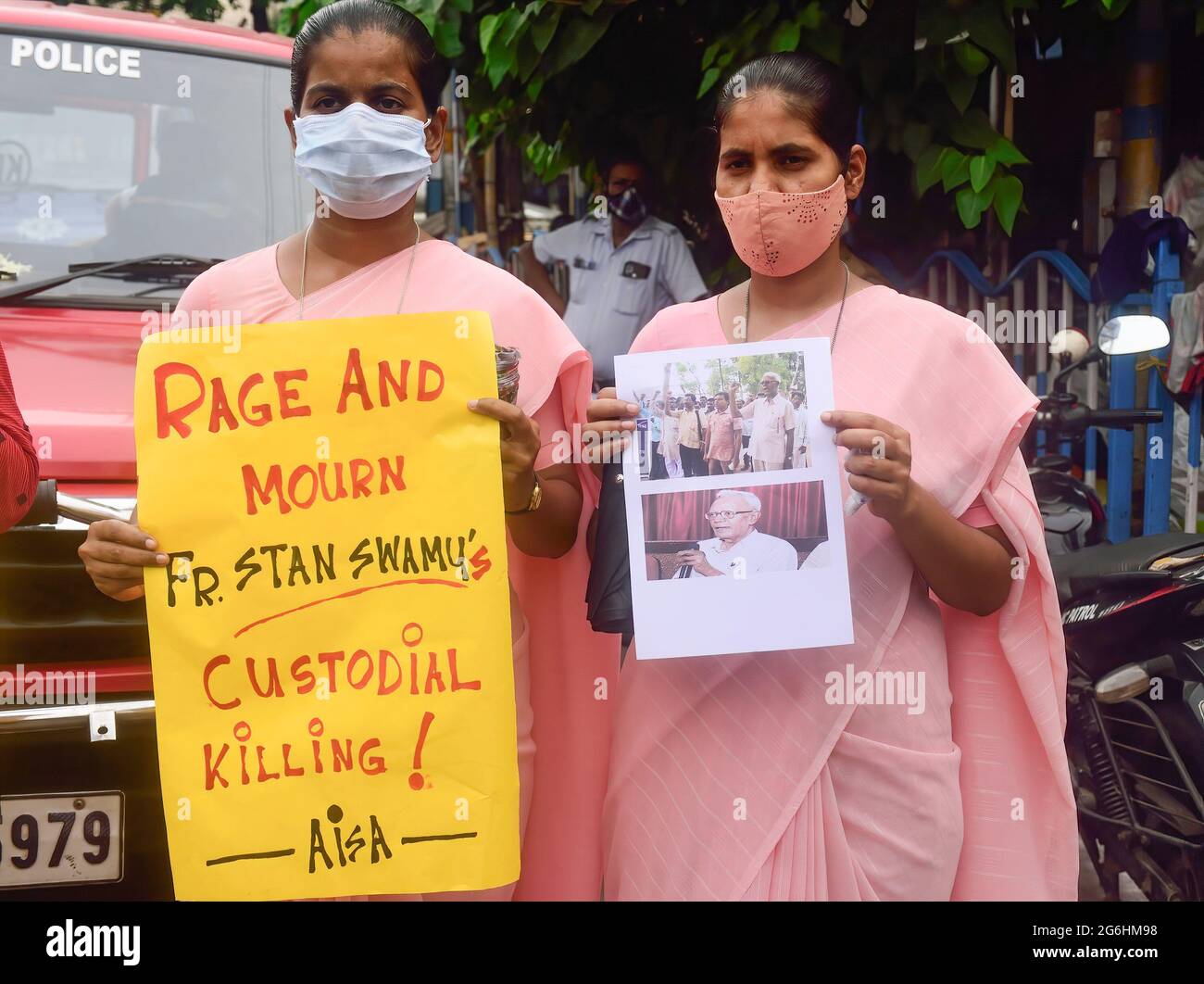 Nuns and other civil society members wearing masks display protest ...
