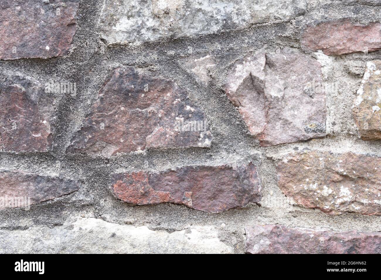A textured stone coloured brick wall Stock Photo - Alamy