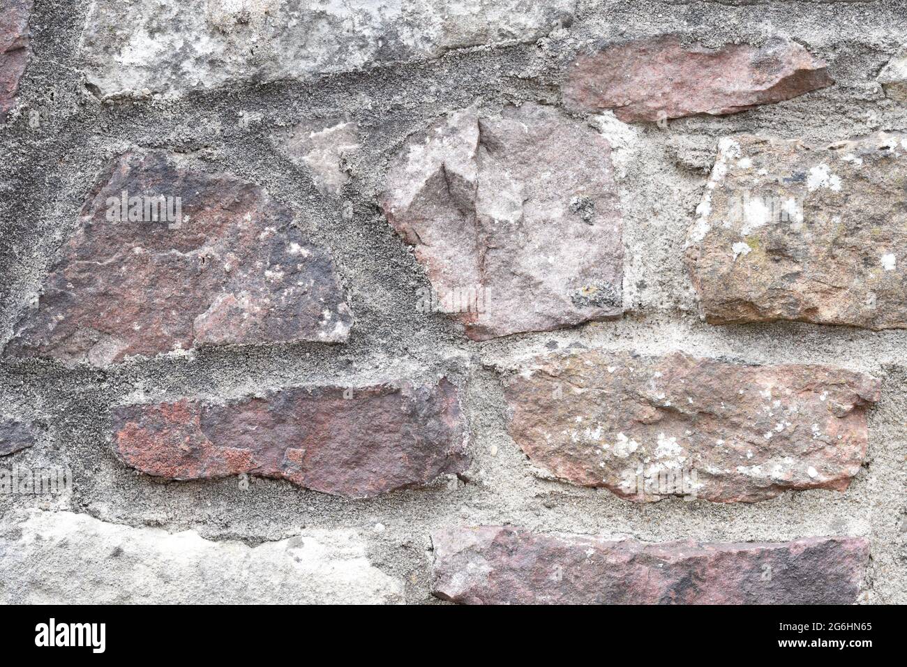 A textured stone coloured brick wall Stock Photo - Alamy