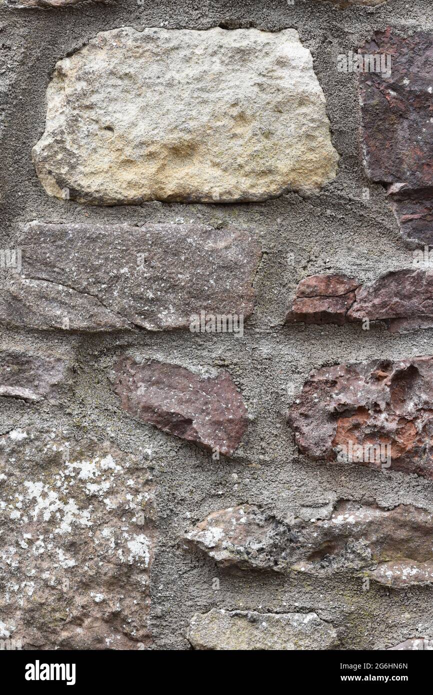 A textured stone coloured brick wall Stock Photo - Alamy