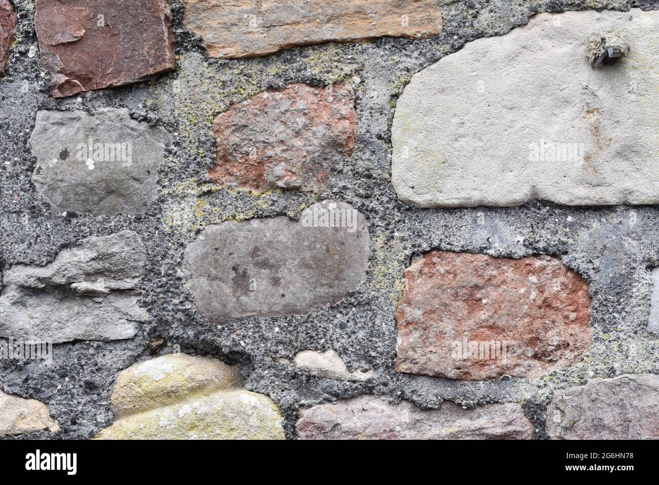 A textured stone coloured brick wall Stock Photo - Alamy