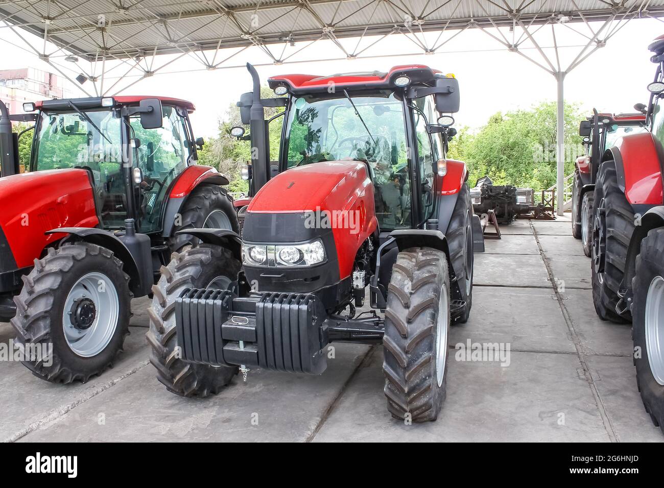 The colorful red tractors. The agriculture, farming concept Stock Photo ...