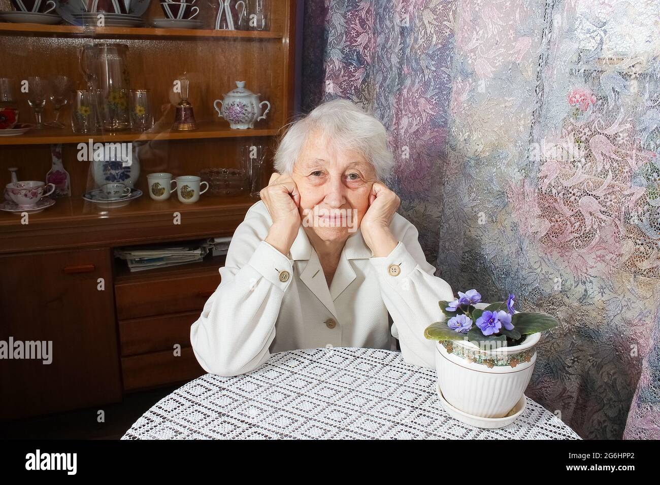 Elderly lady smiling window hi-res stock photography and images - Alamy