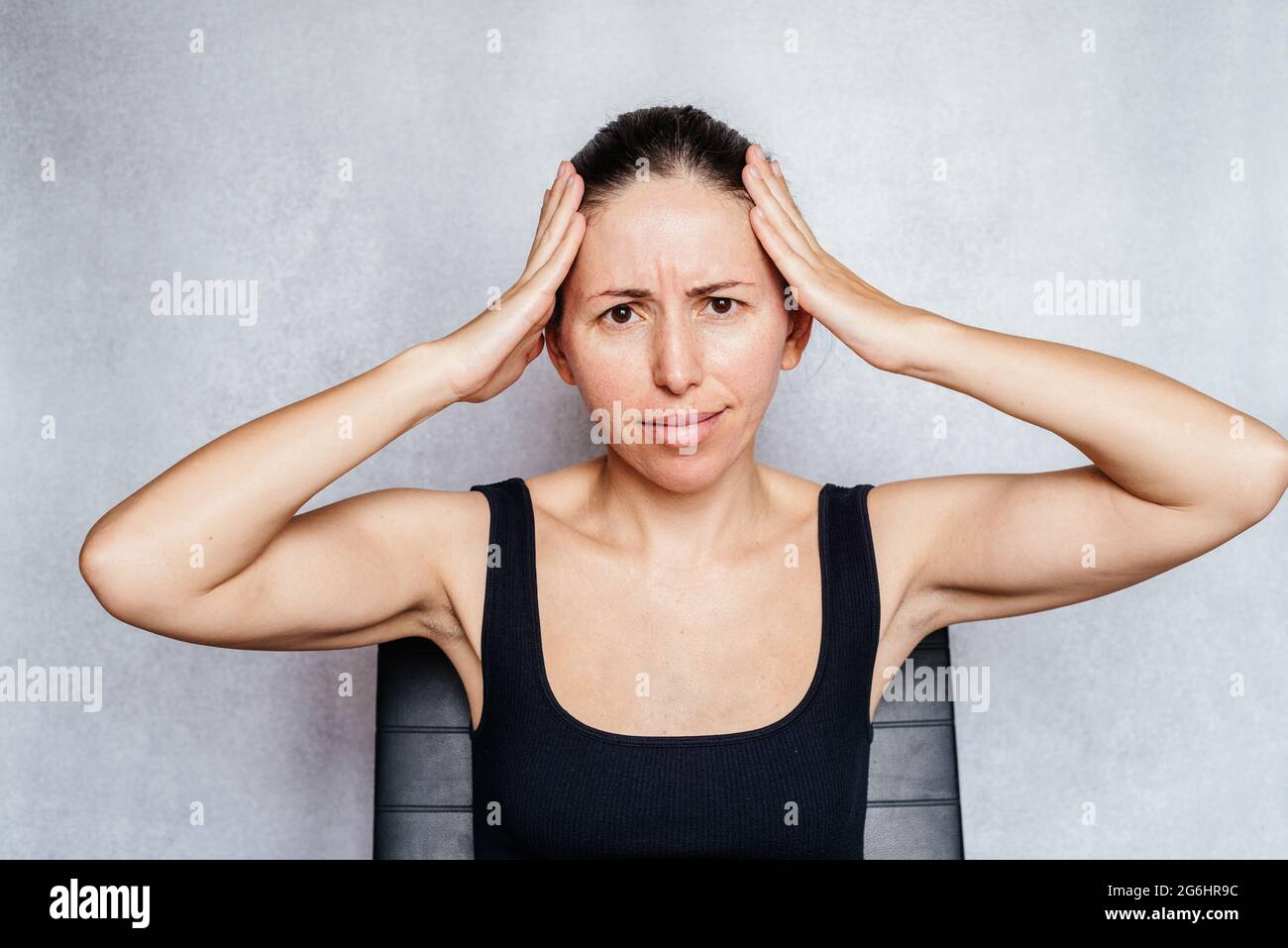 A woman having headache, exercises to beat headache Stock Photo - Alamy
