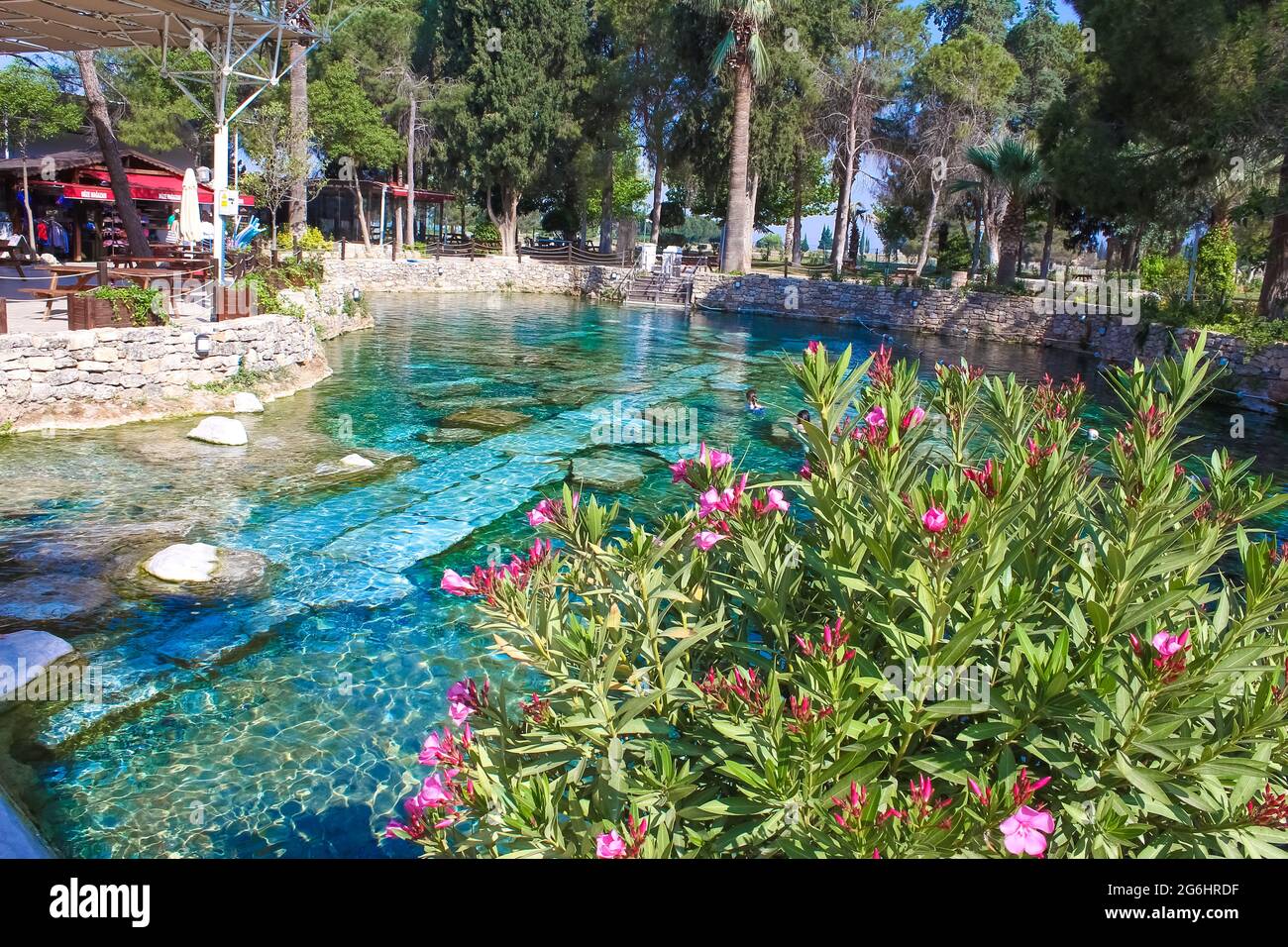 Pamukkale, Turkey- May 11, 2021: people walk and swim in the Cleopatra ...