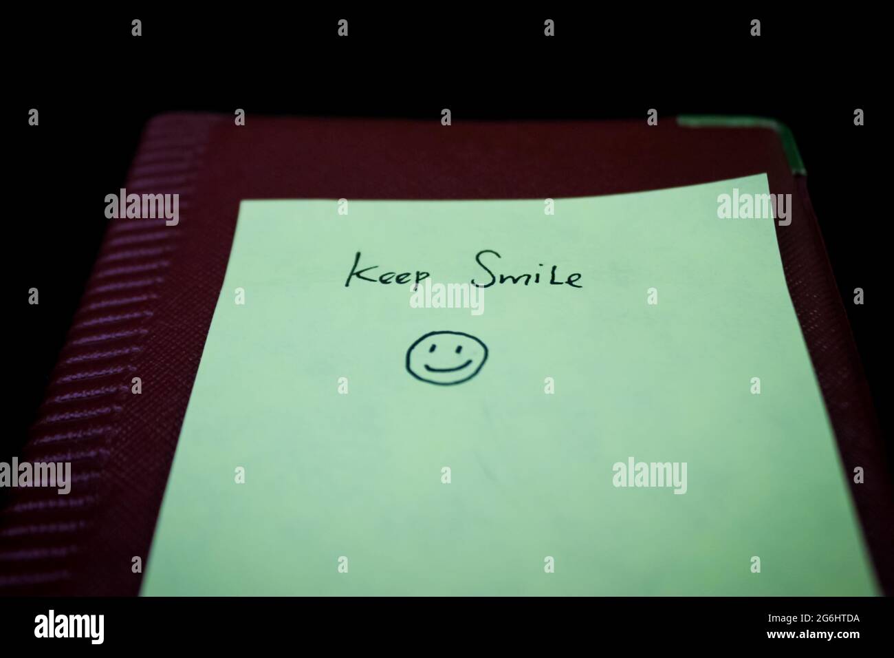 Writing words on a piece of note paper Stock Photo - Alamy