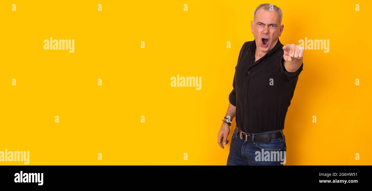 isolated man pointing and shouting on color background Stock Photo - Alamy
