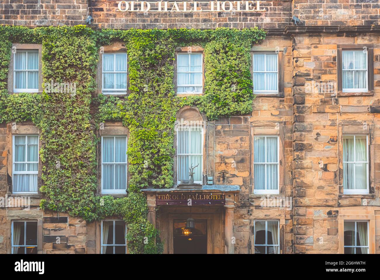 Buxton, UK - June 26 2021: The grand stone facade decorated with green ...