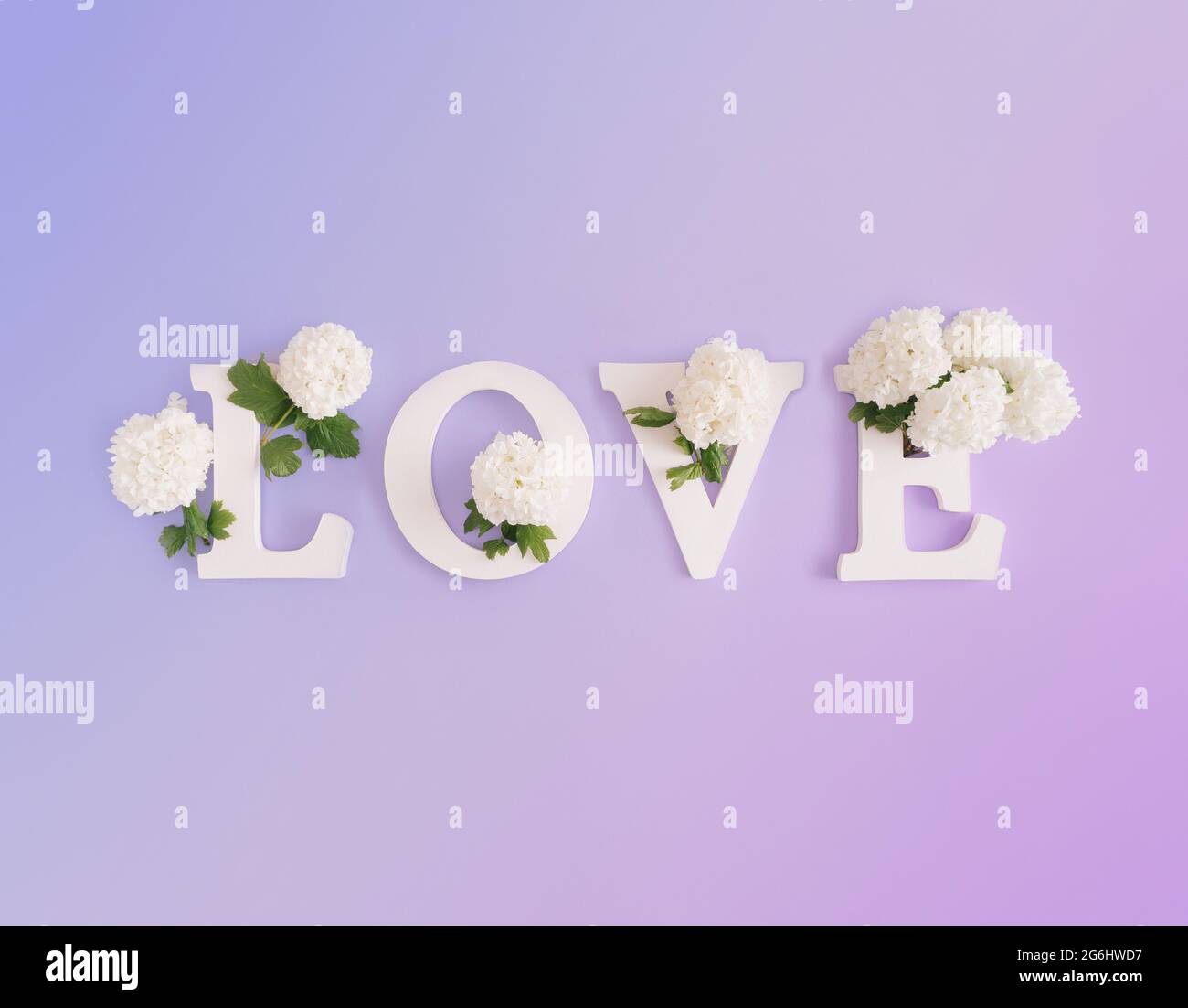 White letters on pastel blue and purple gradient background. Word LOVE ...