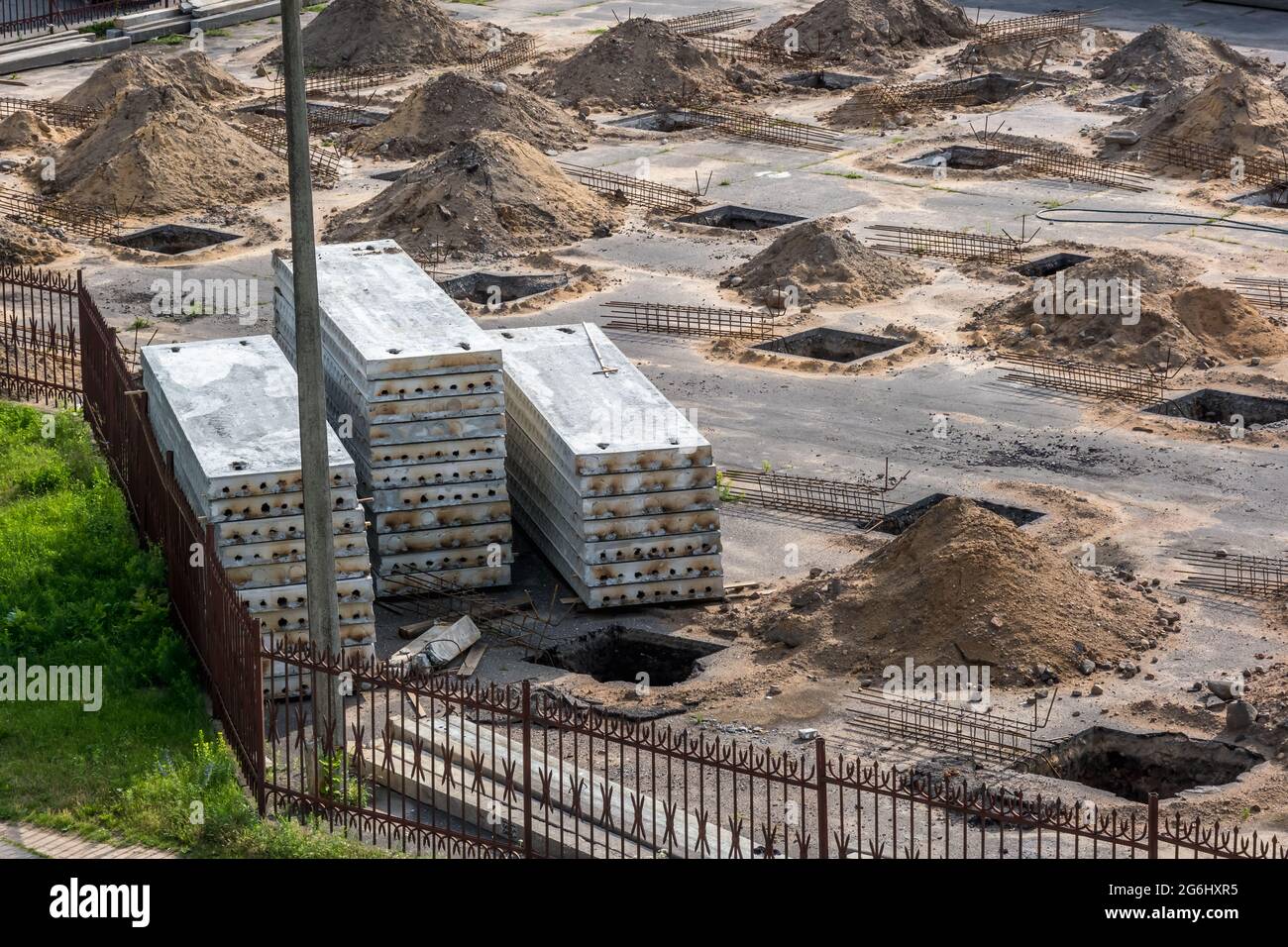 rows of pits at a construction site. preparation of the site for the ...