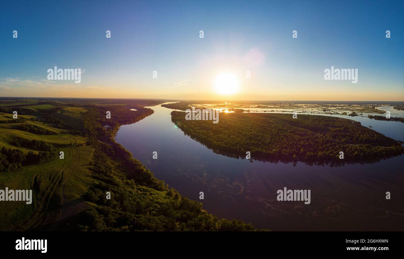 Aerial drone view of river landscape in sunny summer sunset. Top view ...