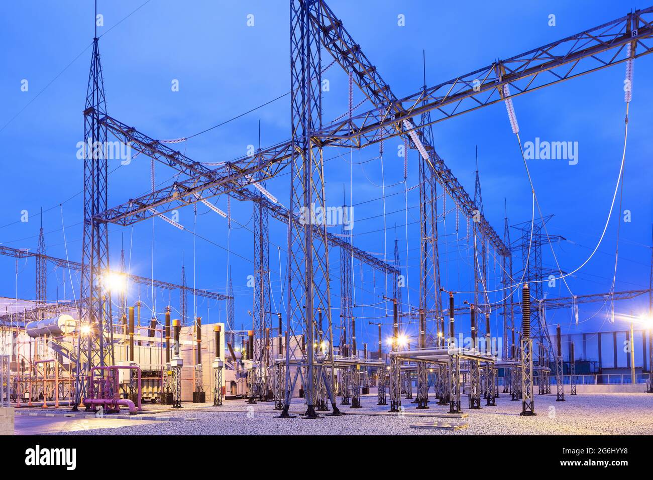Illuminated electricity substation at dusk Stock Photo - Alamy
