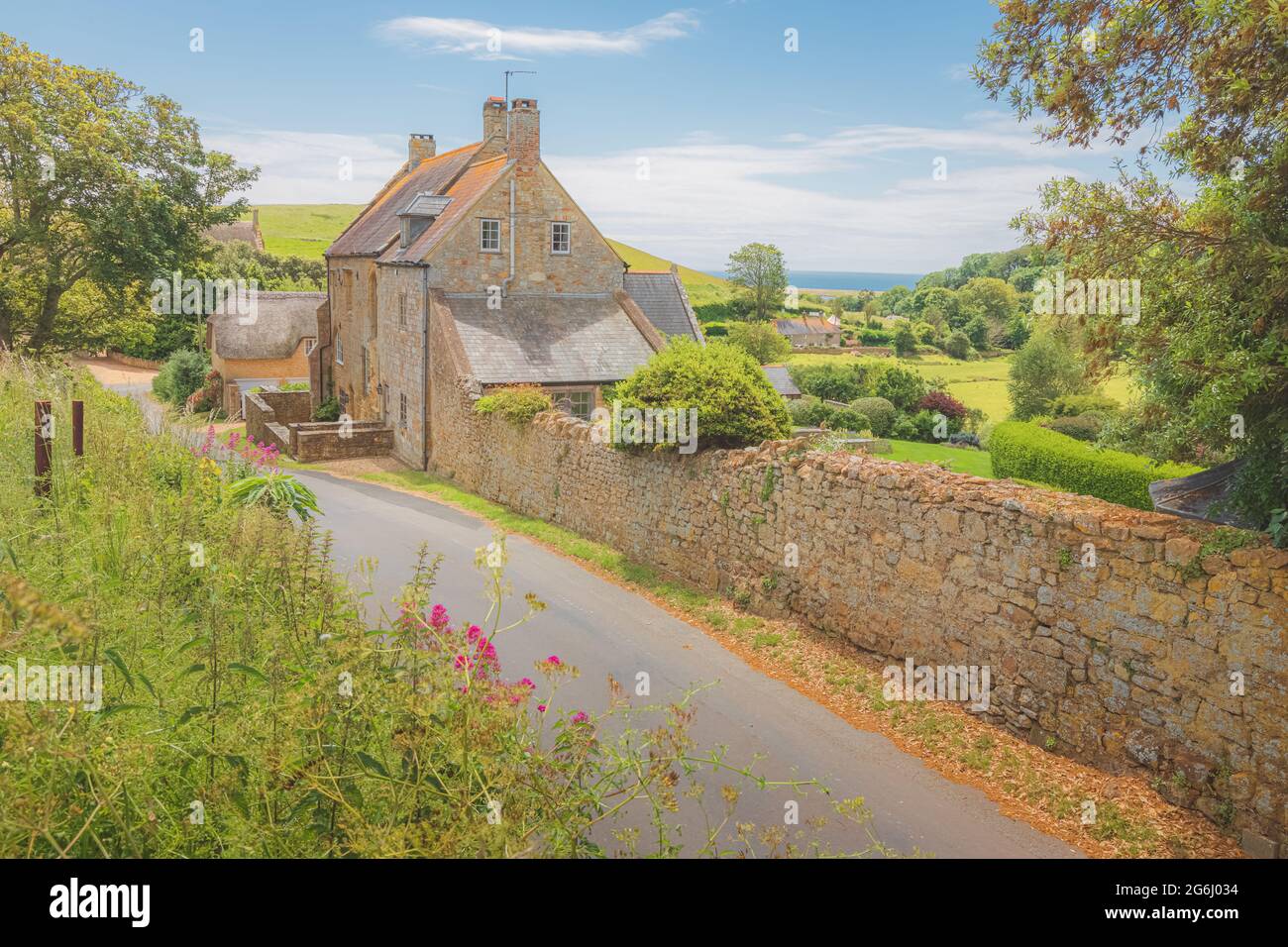 Traditional stone cottage farmhouse on a country lane in the quaint ...