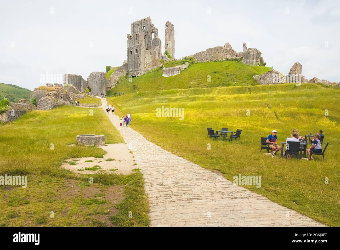 Corfe Castle, UK - June 24 2021: Tourists visit the hilltop medieval ...