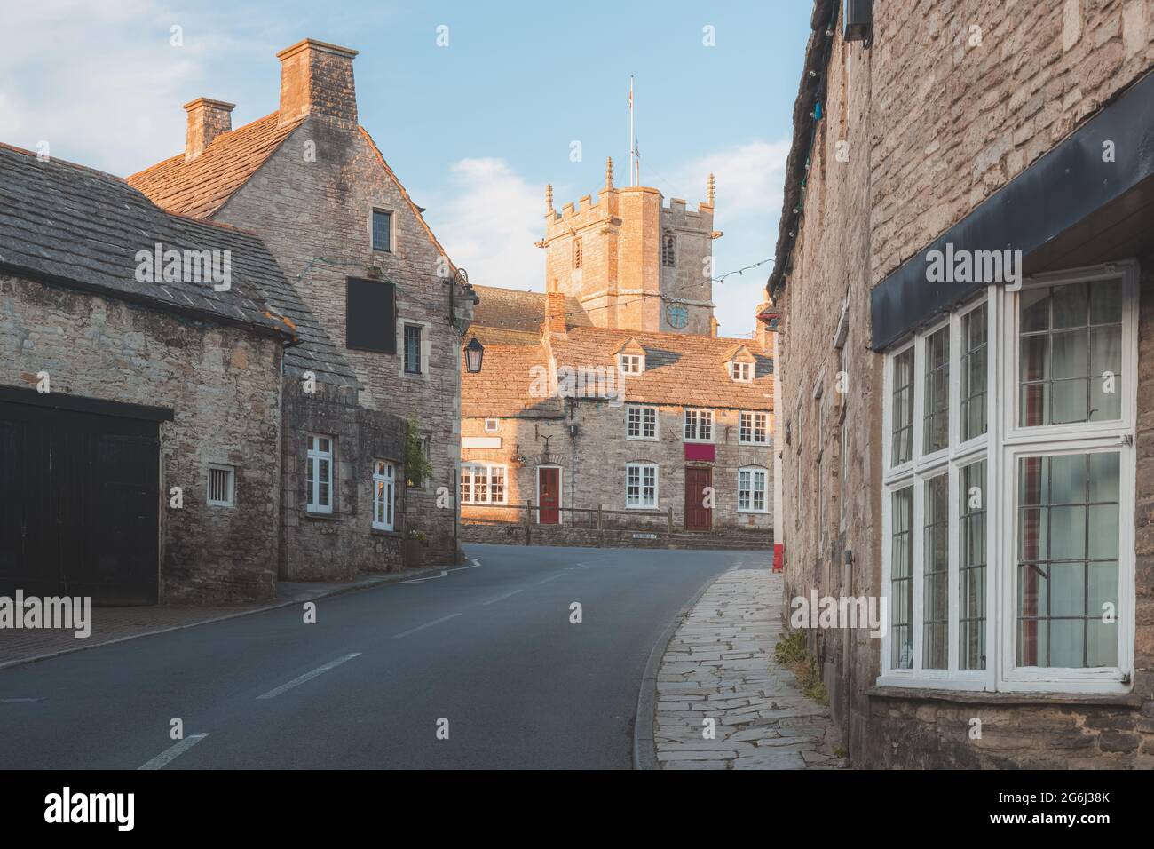 Quaint, historic medieval village of Corfe Castle, Dorset, England with ...