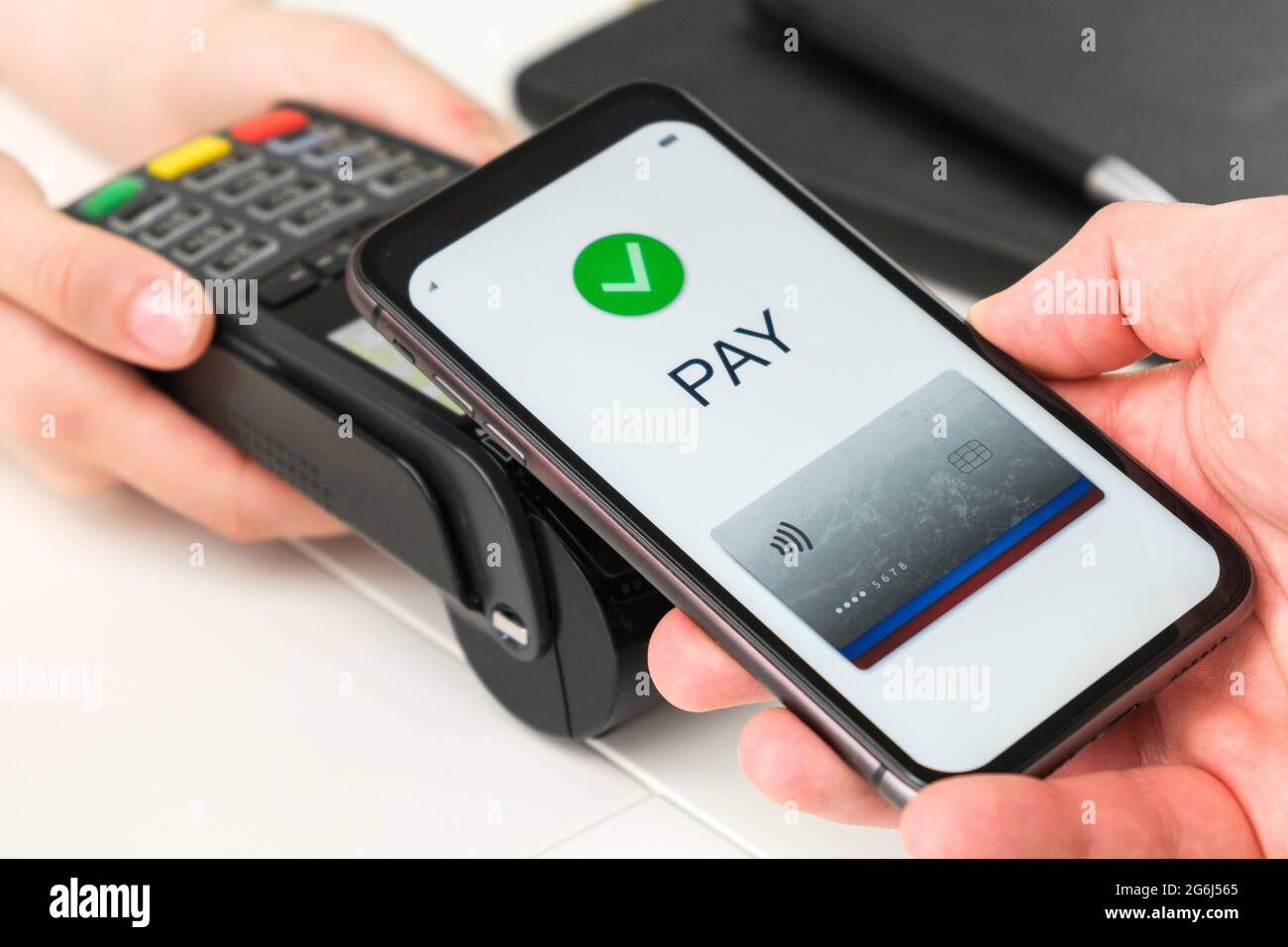 Contactless payment using smartphone by POS payment terminal Stock ...