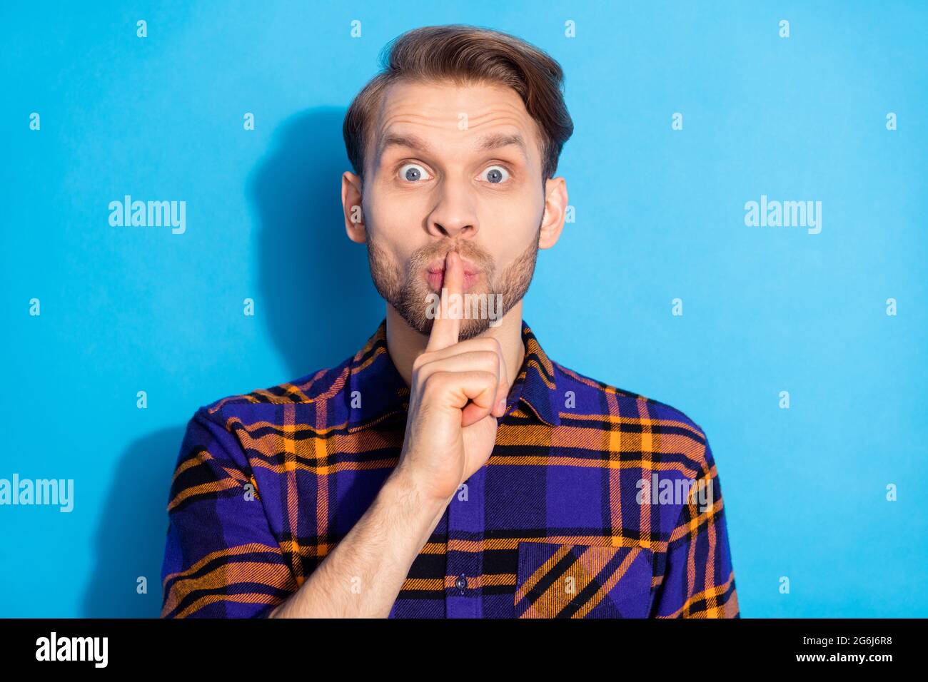 Photo of worried person finger covering lips do not tell staring camera ...