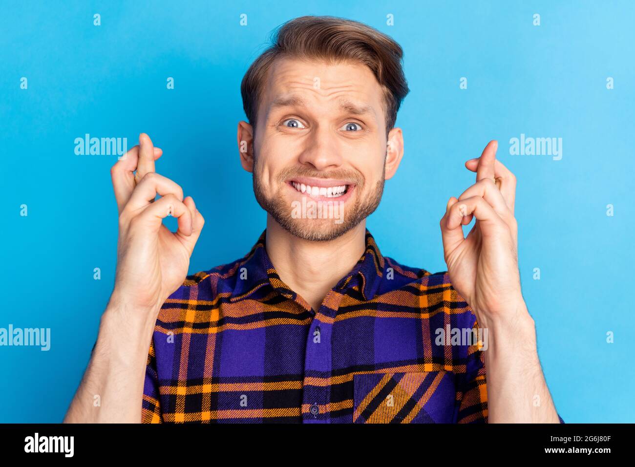 Photo of worried young person two arms crossed fingers biting lip ...
