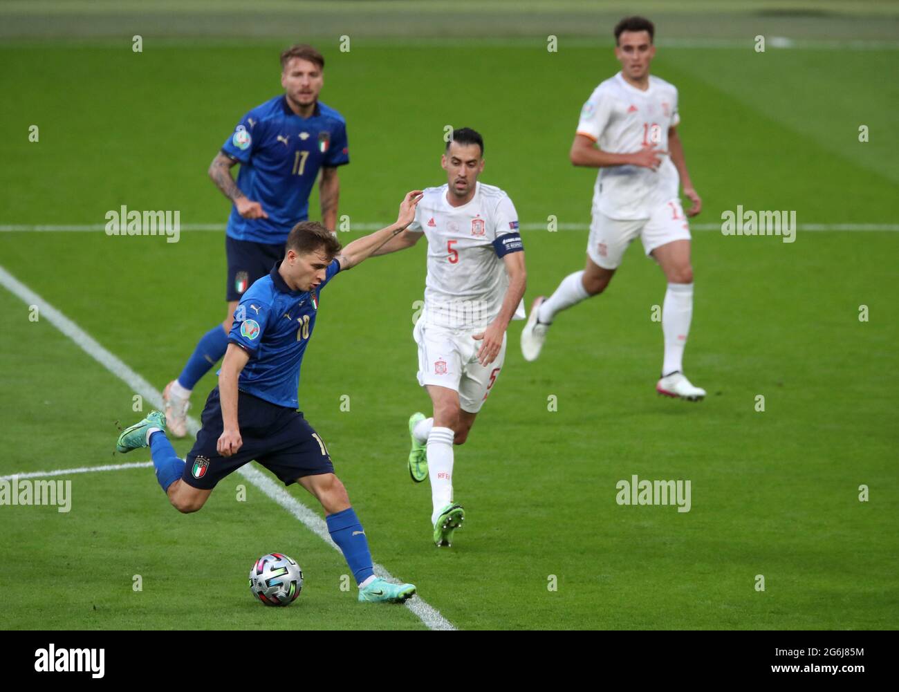 Italy's Nicolo Barella (left) prepares to shoot on goal during the UEFA ...