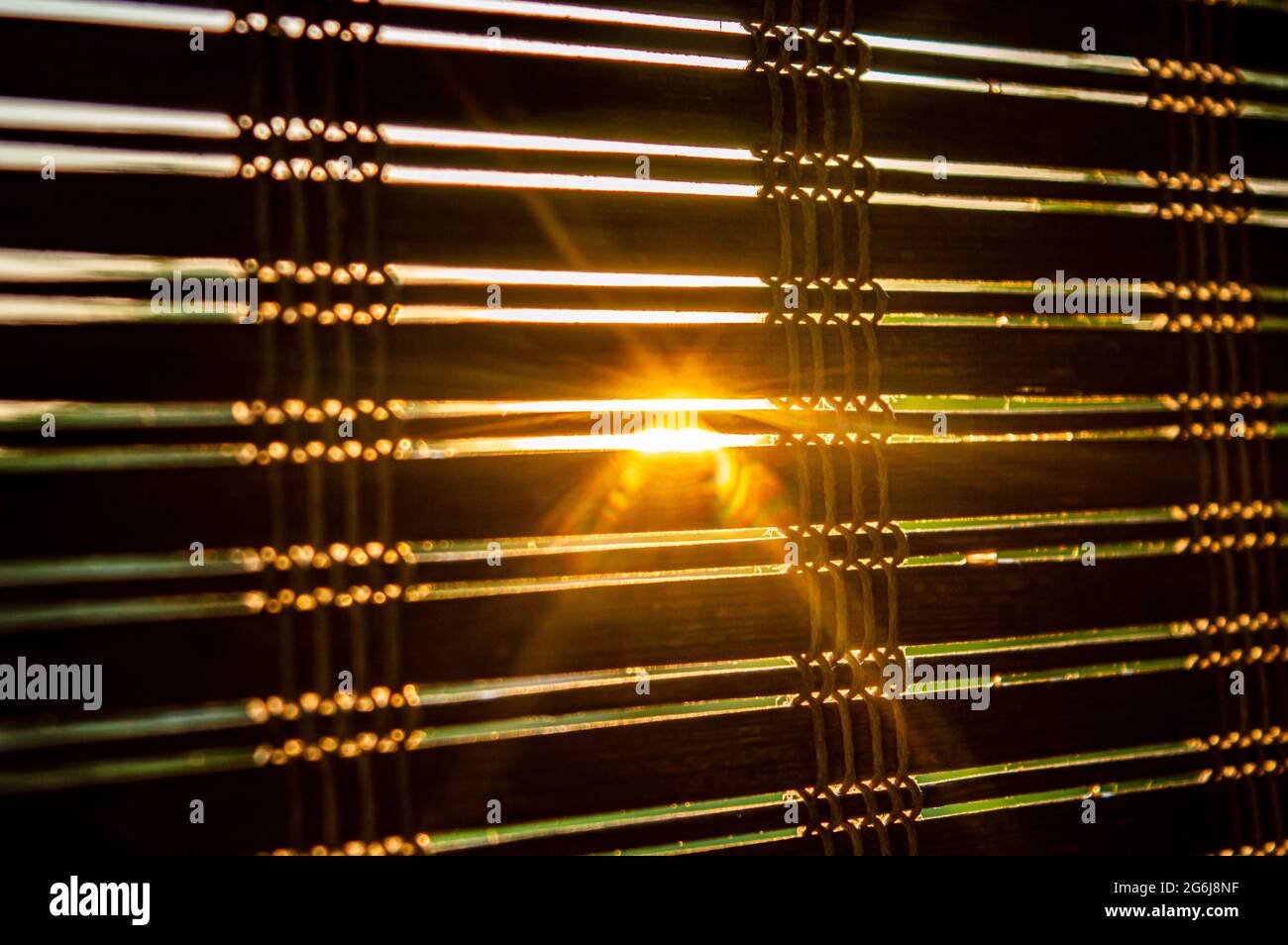 the evening sun peeking through the curtain. sunset moment. sunlight ...