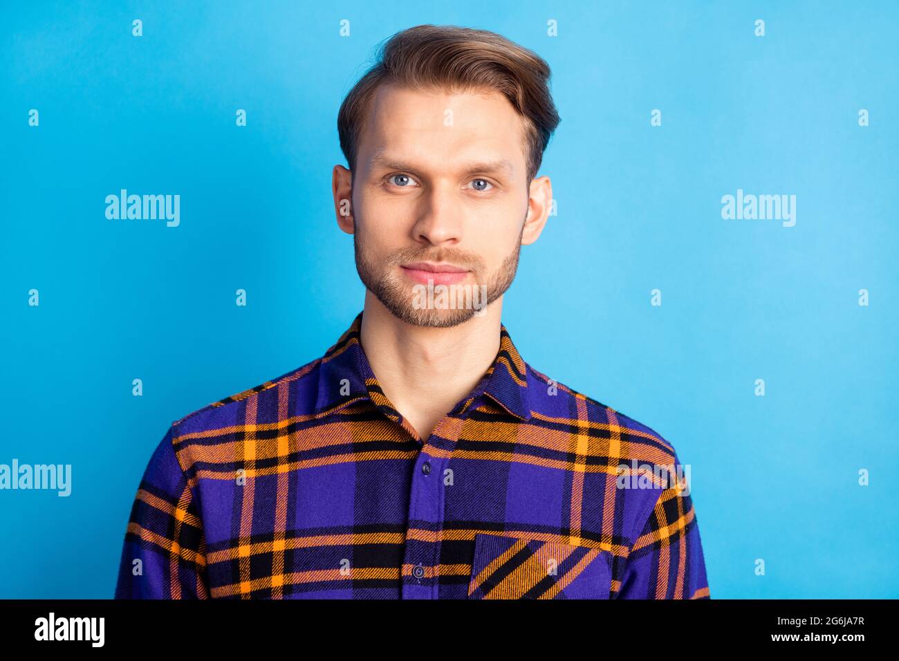 Photo of young man look attentively camera no emotions wear plaid ...