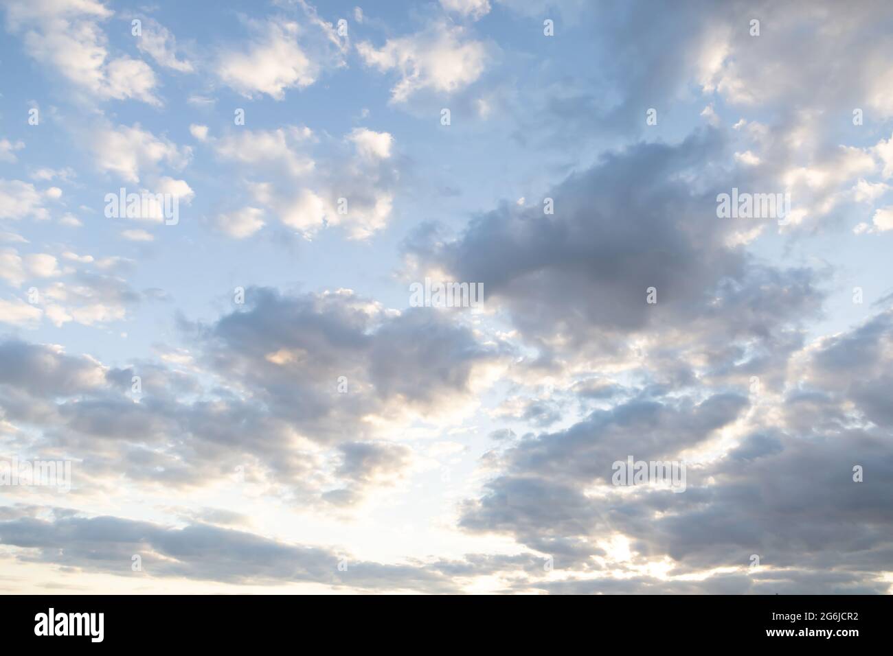 Dynamic clouds abd sky with the sun peeking through Stock Photo - Alamy