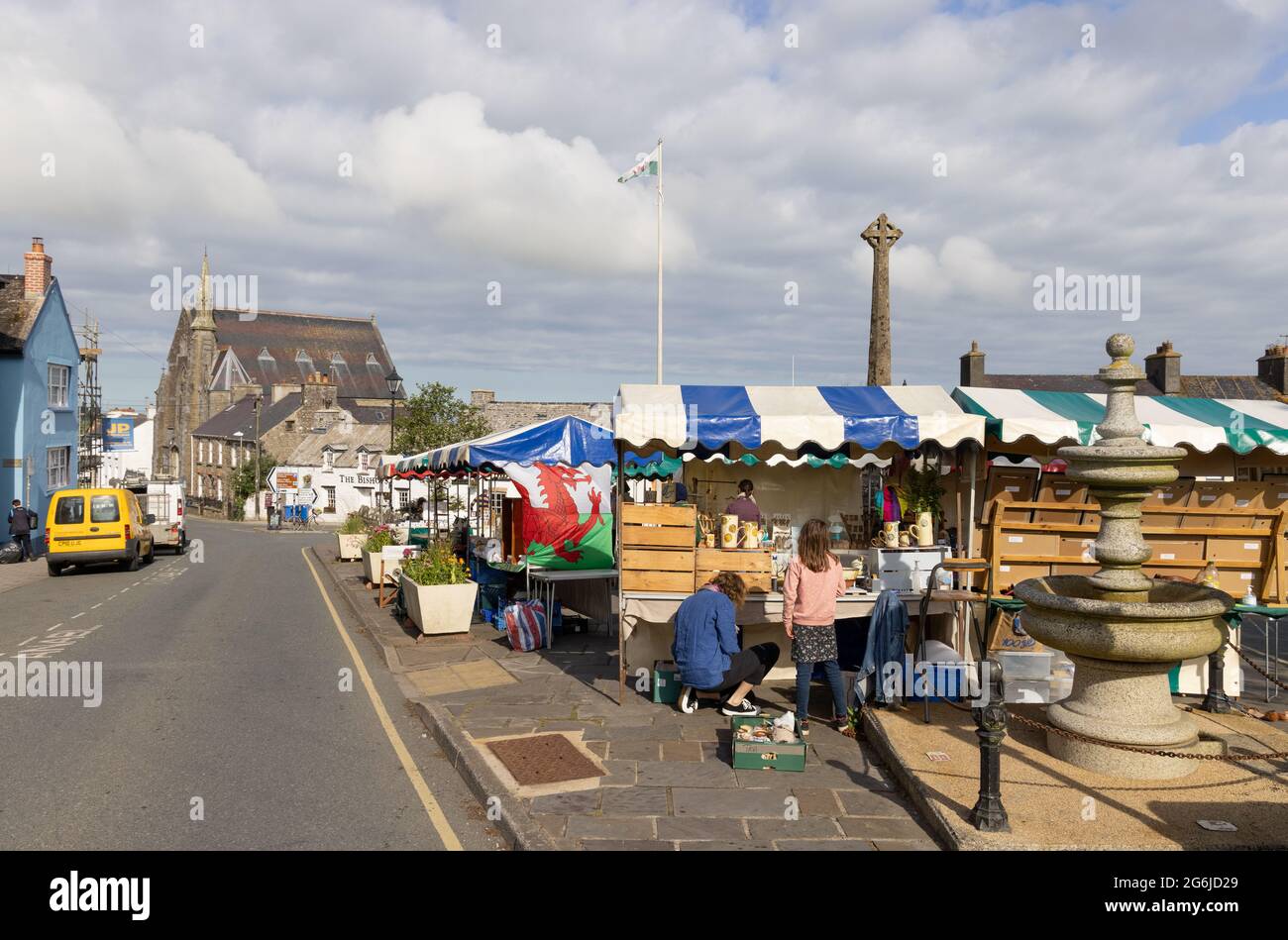 Welsh market; people attending the stall at the outdoor market, St ...