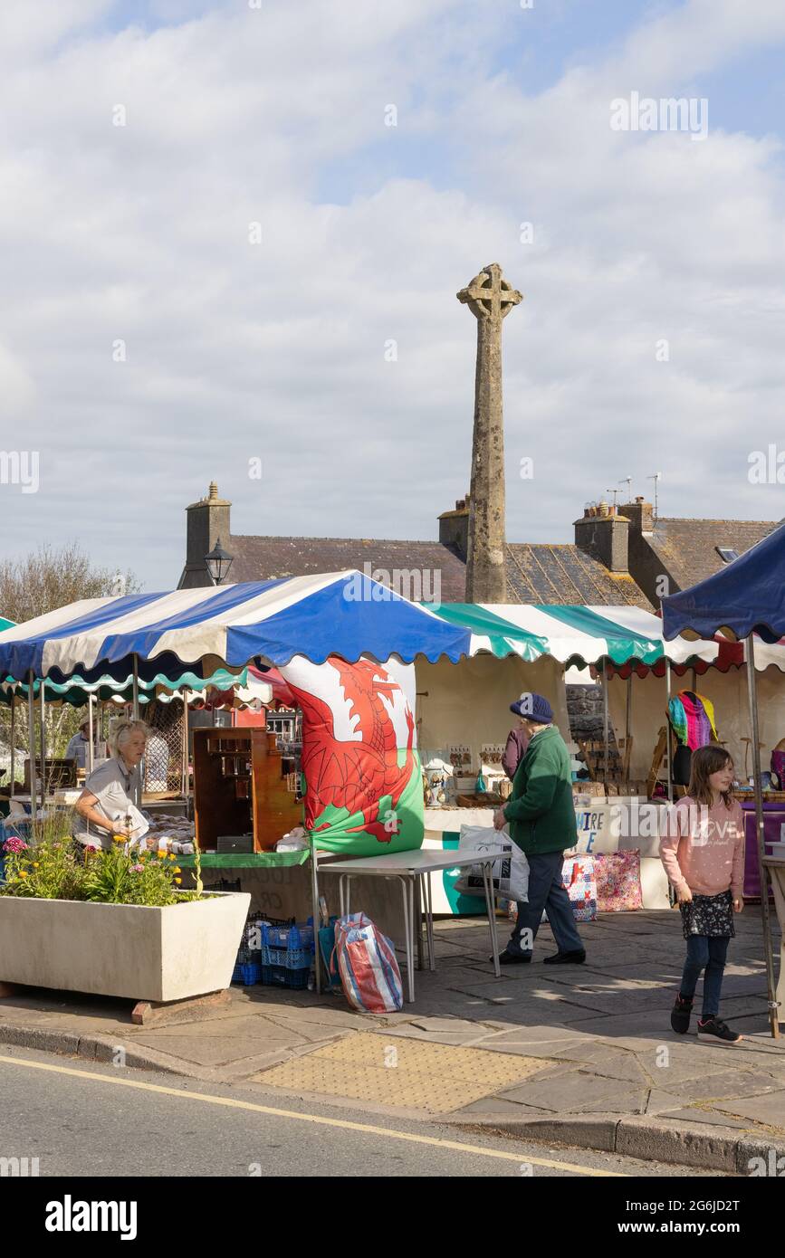 Wales market; people attending the stall at the outdoor market, St ...