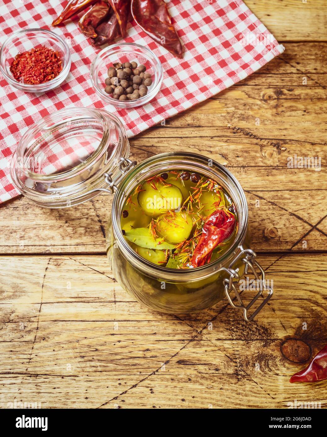 Vegan food composition with homemade pickles in brine with spices in a ...