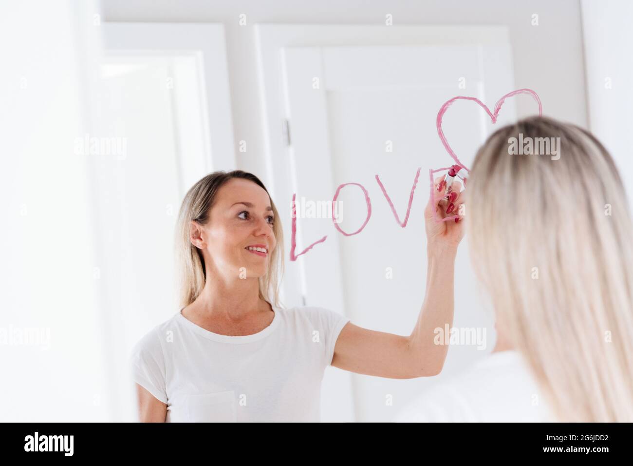 Woman kiss mirror hi-res stock photography and images - Alamy