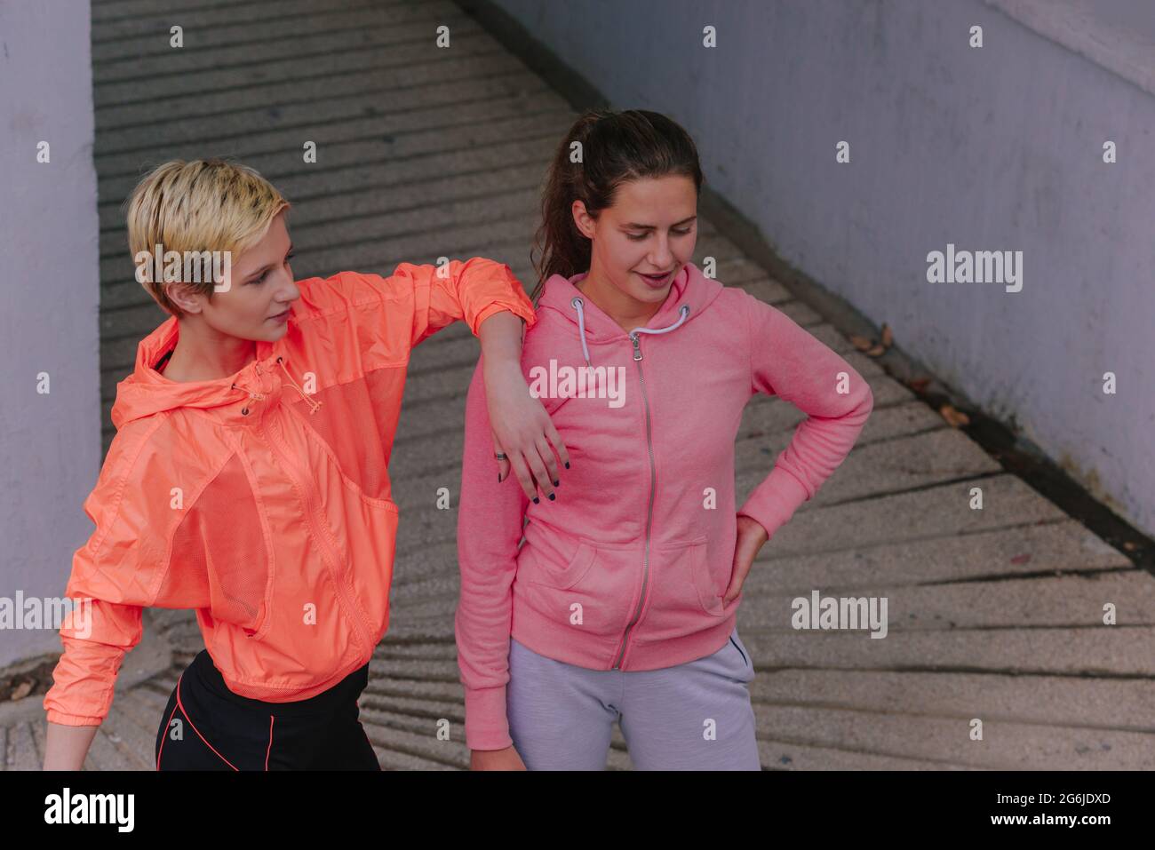 Fit female runners performing their sport activity outdoors Stock Photo ...