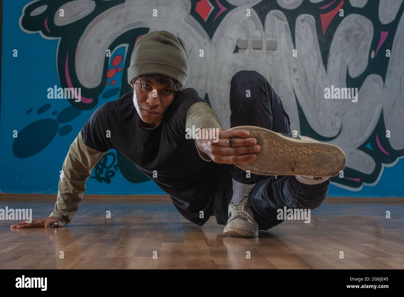 Modern rapper dancing in garage. Urban lifestyle, hip hop Stock Photo ...