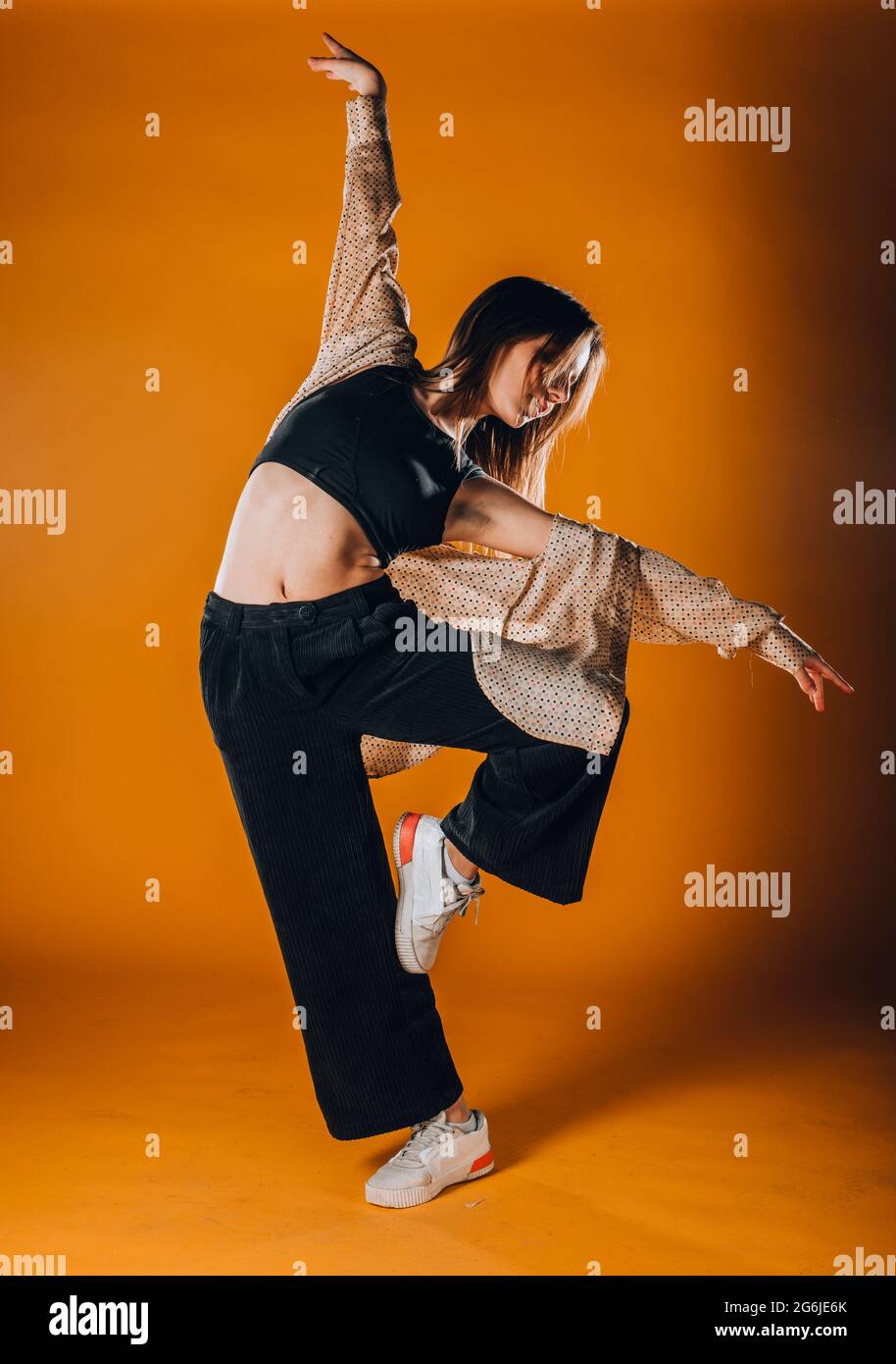 Modern dance performer practicing dance moves at the studio Stock Photo ...