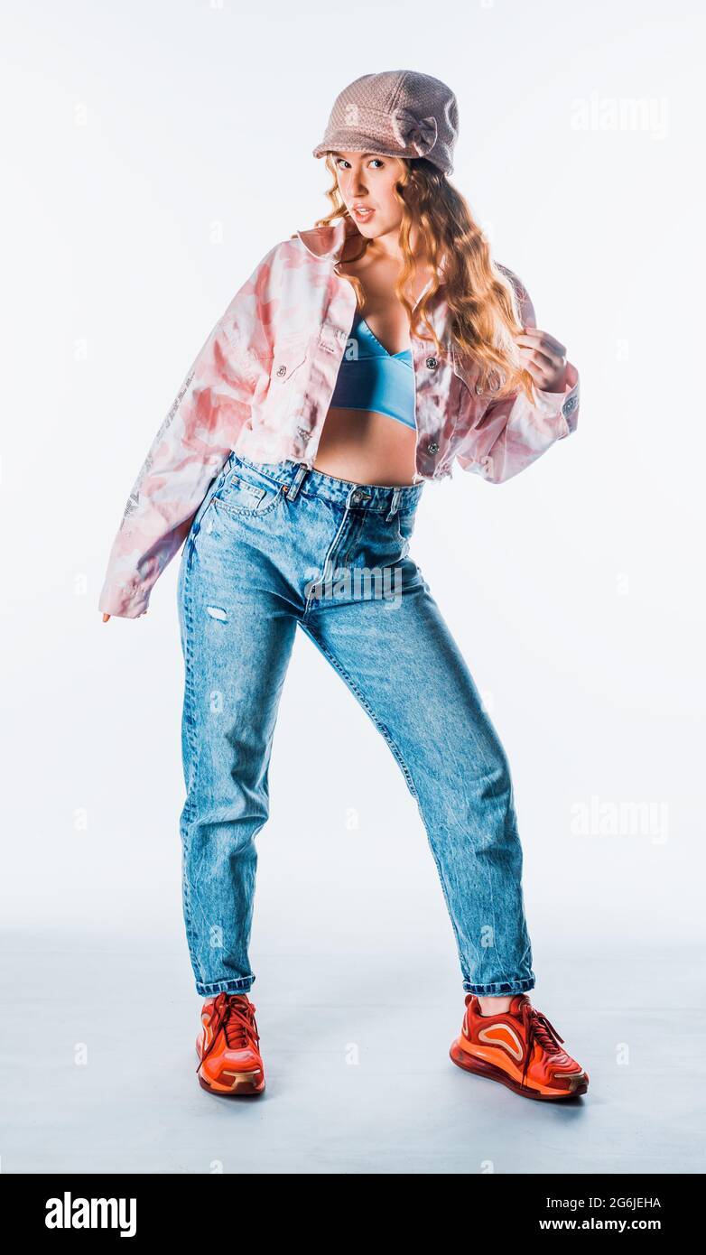 Body shot of an attractive female model posing in modern style clothes ...