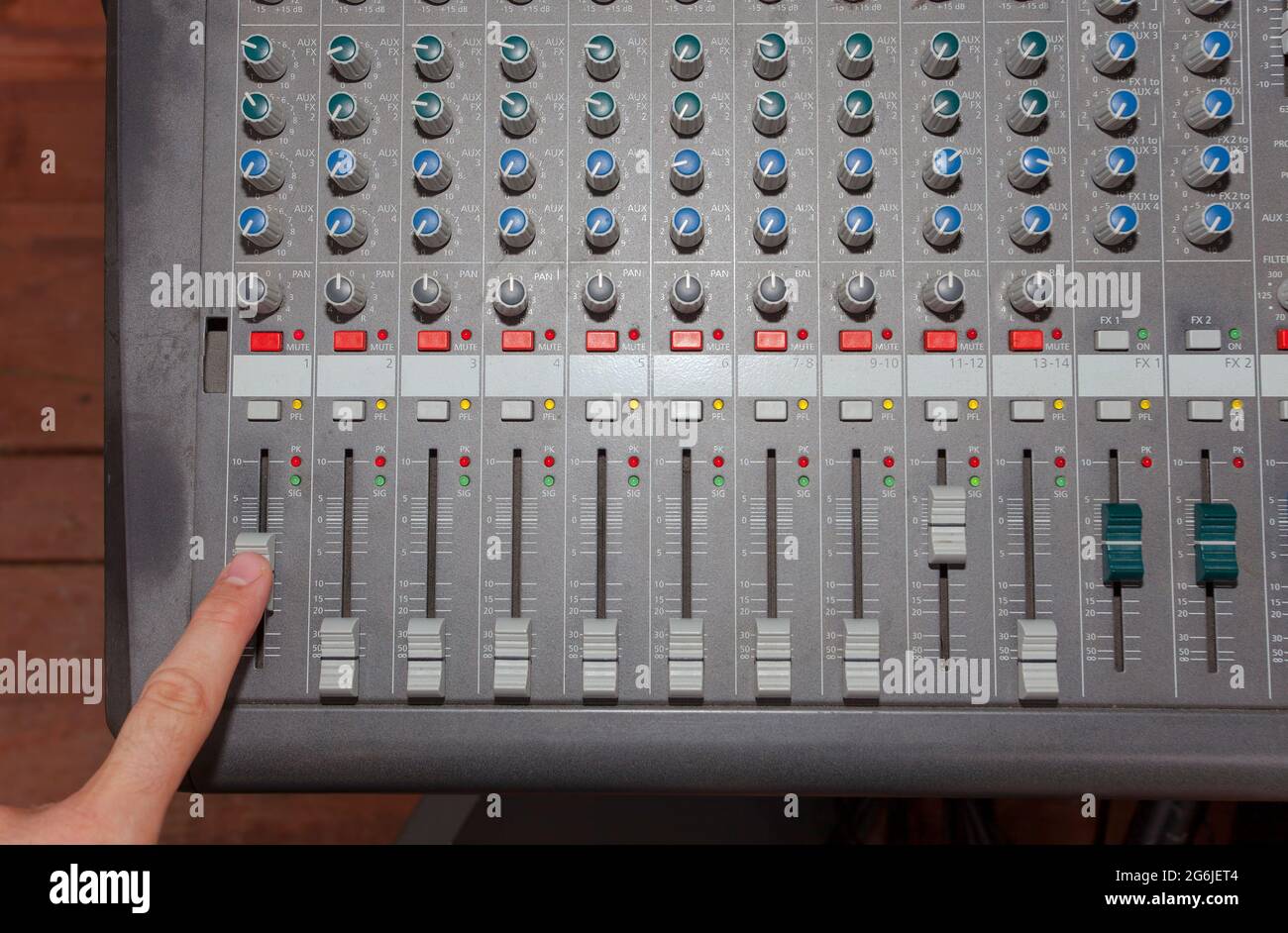 finger on volume. music equipment for sound equalizer Stock Photo - Alamy