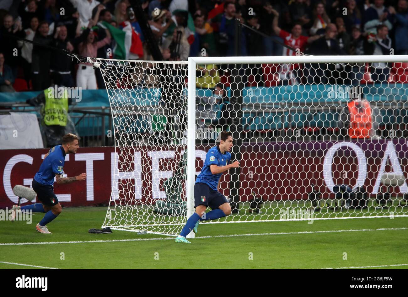 Italy's Federico Chiesa (centre) celebrates scoring their side's first ...