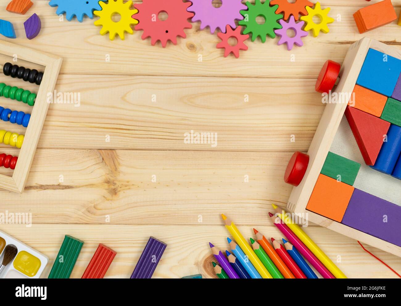 Colorful math fractions, cubes, pencils on wooden table. Interesting ...