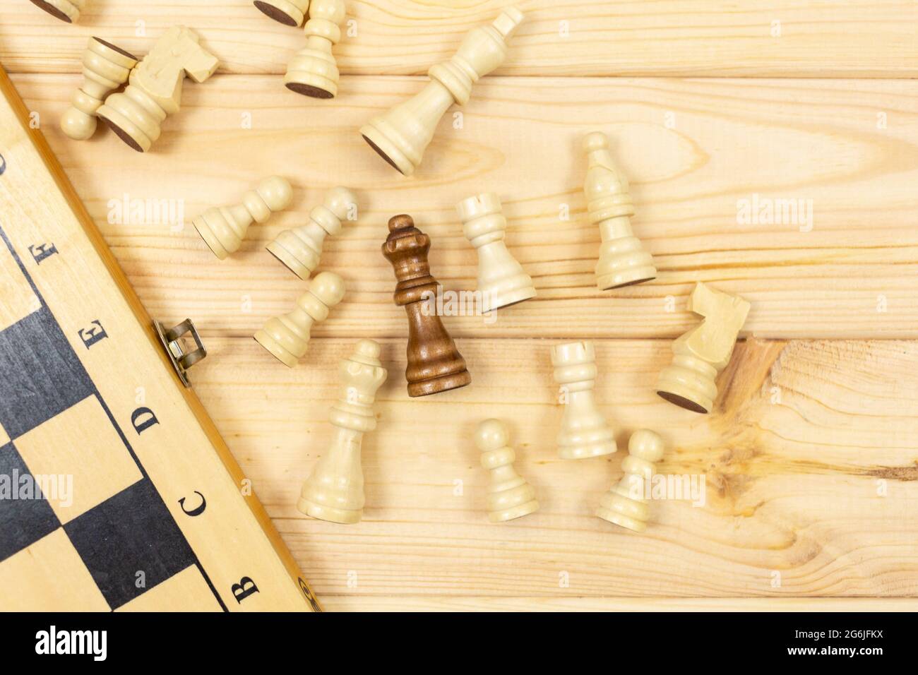 Chess board and chess figures on wooden background. Popular logic game ...