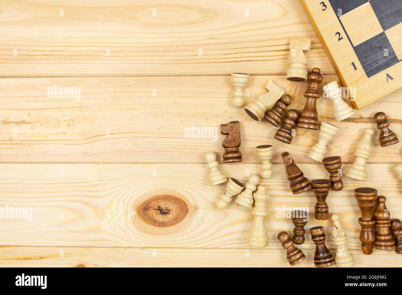 Chess board and chess figures on wooden background. Popular logic game ...