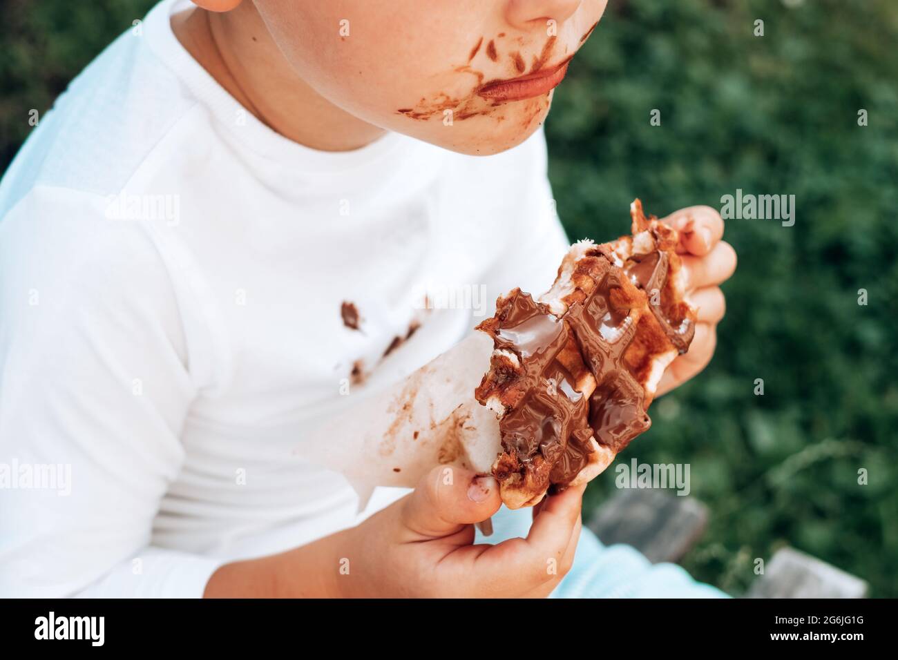 Boy eating chocolate messy hi-res stock photography and images - Alamy