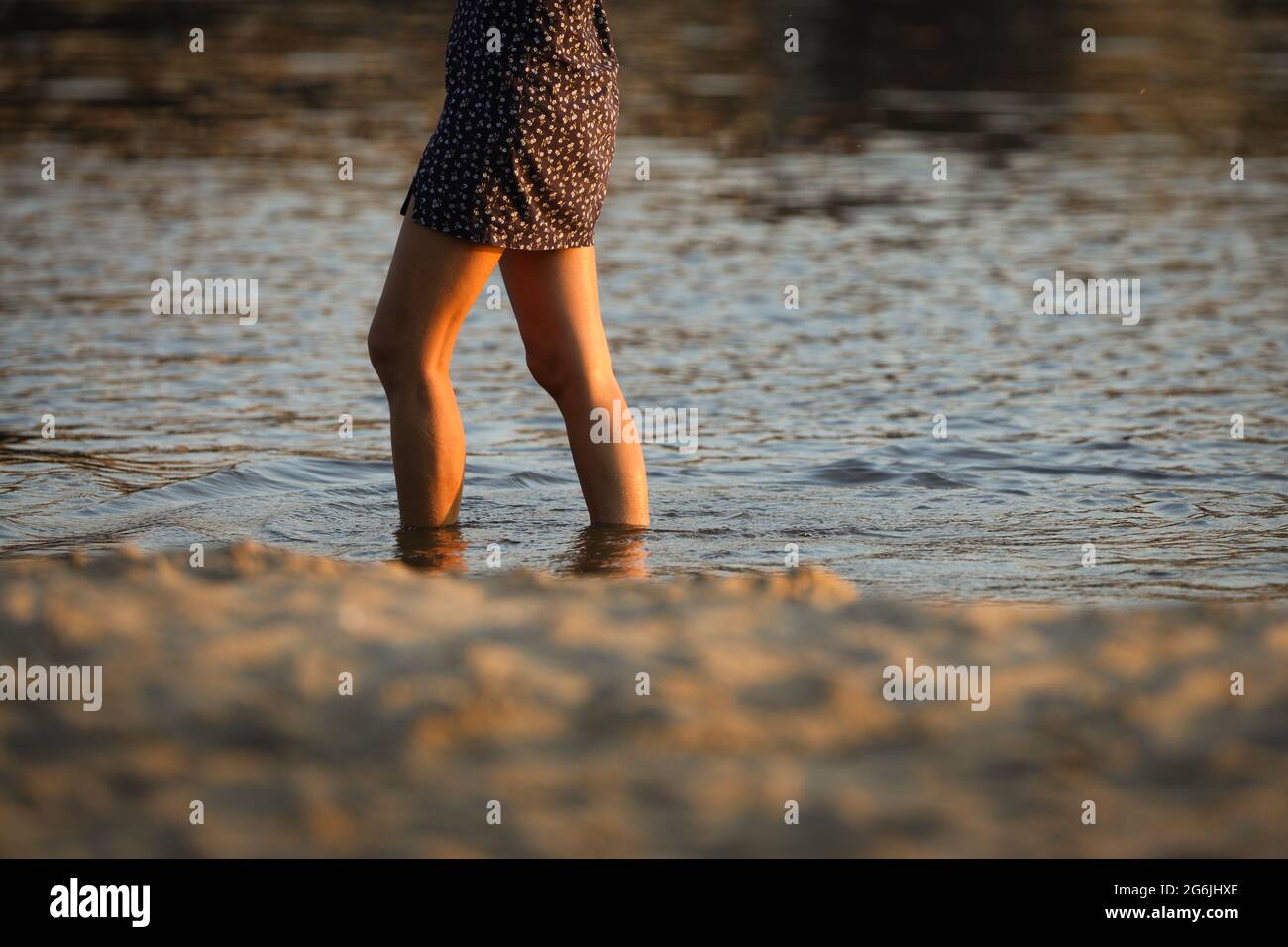 People are seen enjoying the warm weather at at a beach on the Vistula ...