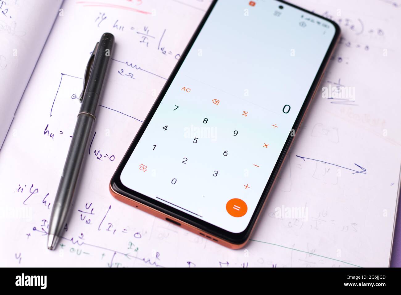 Phone calculator with notebooks stock image Stock Photo - Alamy