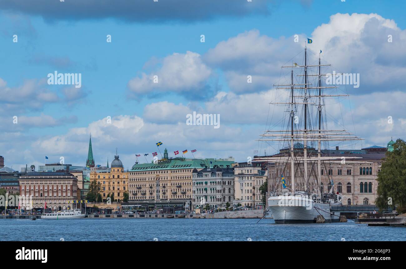 A picture of a classic steel ship docked in Stockholm, next to the area ...