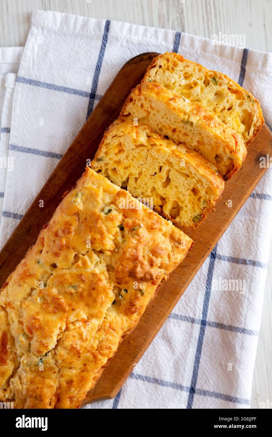 Homemade Cheesy Bread Loaf on a rustic wooden board, top view. Flat lay ...