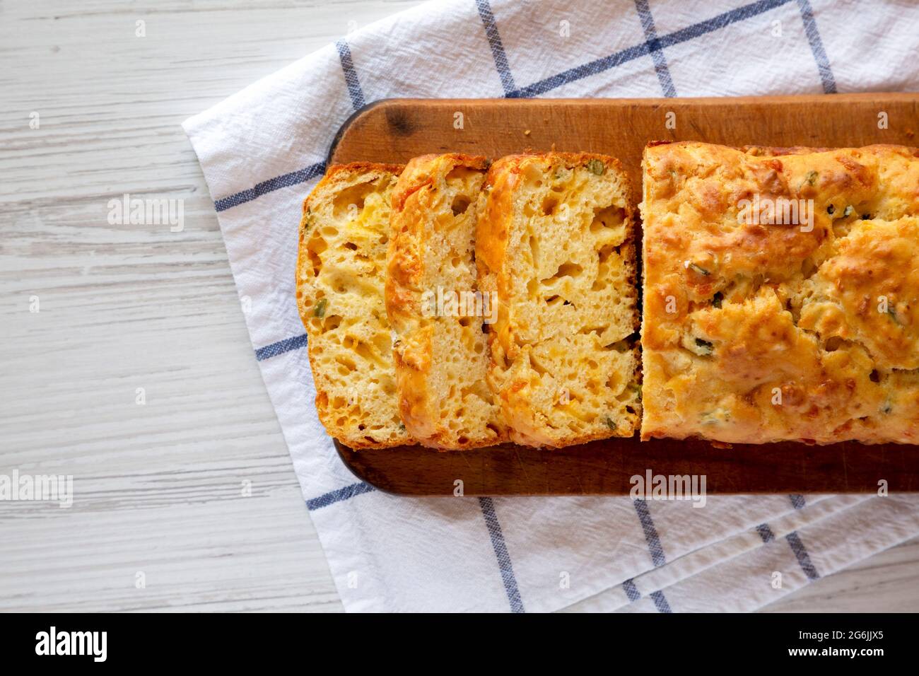 Homemade Cheesy Bread Loaf on a rustic wooden board, top view. Flat lay ...