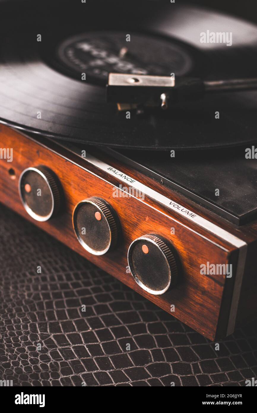 Record player with vinyl disc on table in room Stock Photo - Alamy