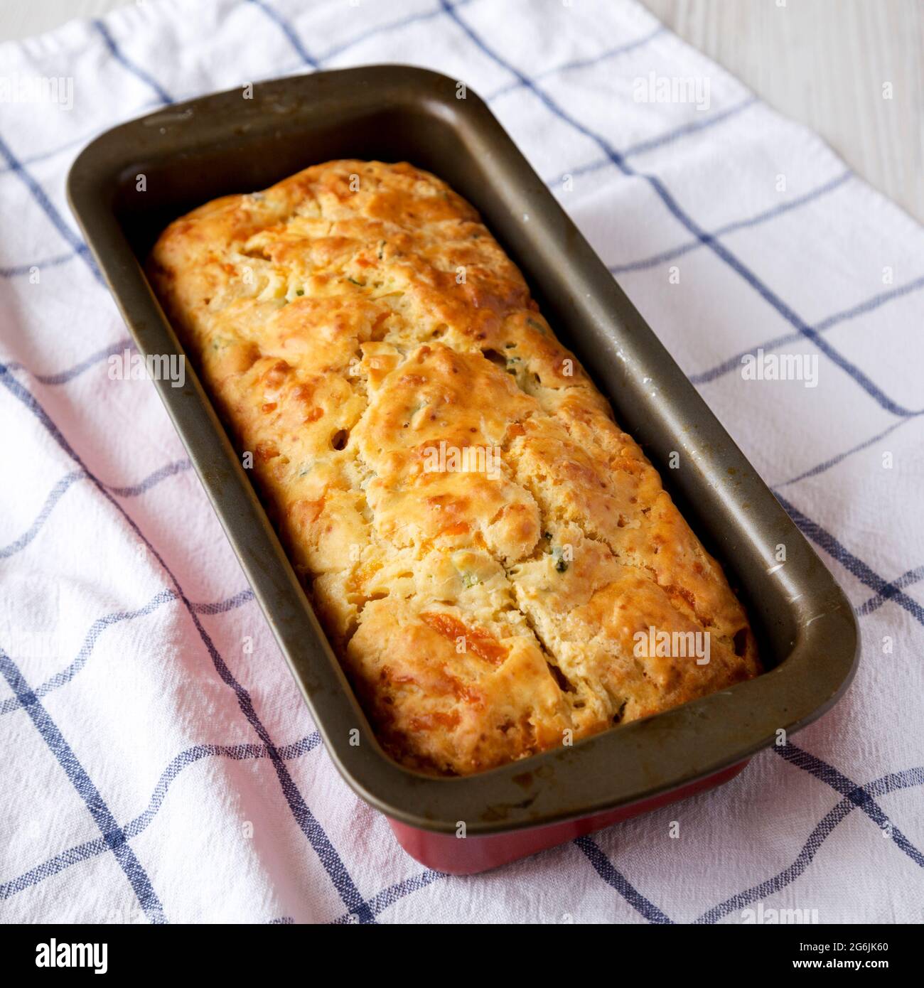 Homemade Cheesy Bread Loaf on a white wooden background, low angle view ...